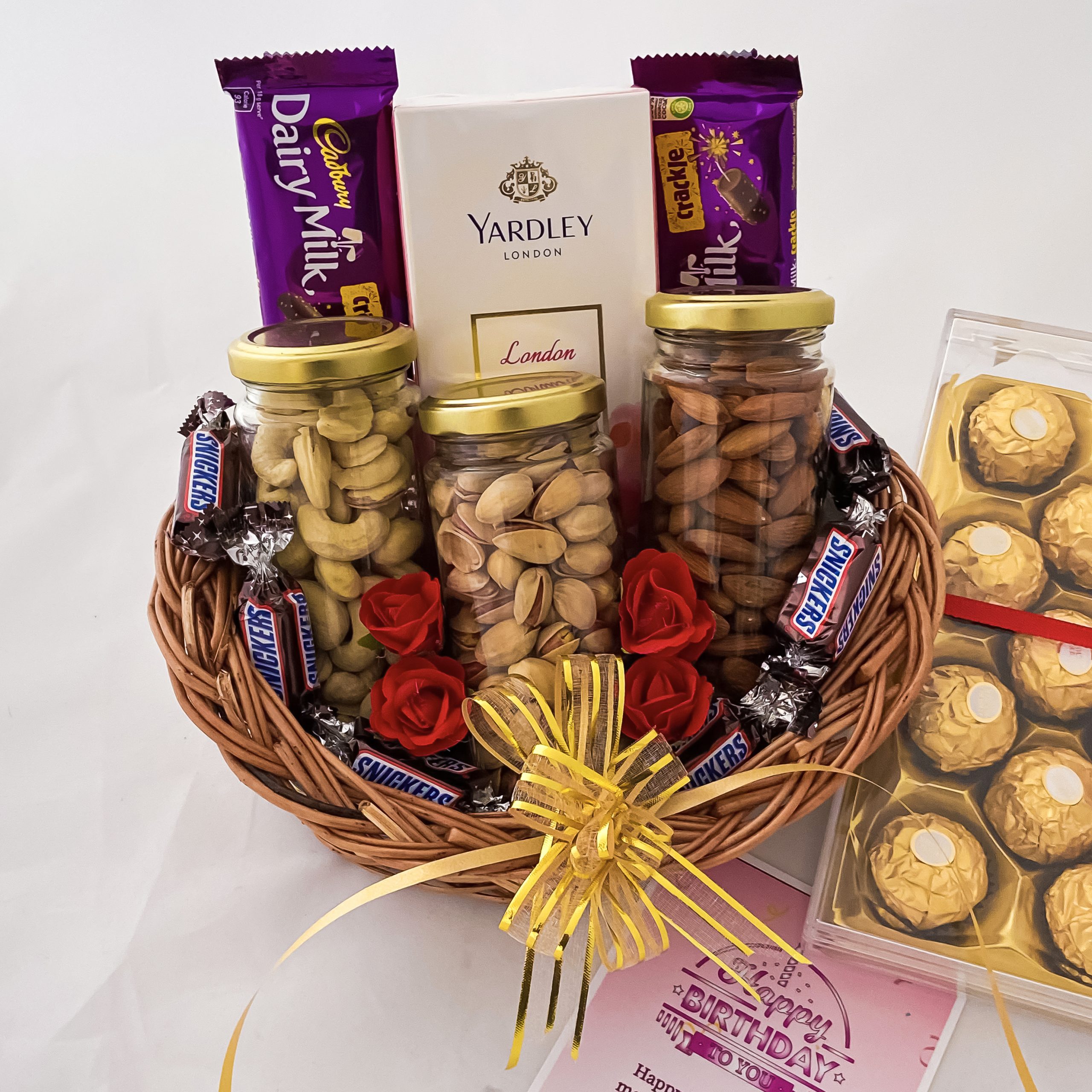 Delightful Birthday gift hamper with lovely nuts bottles,snickers ...
